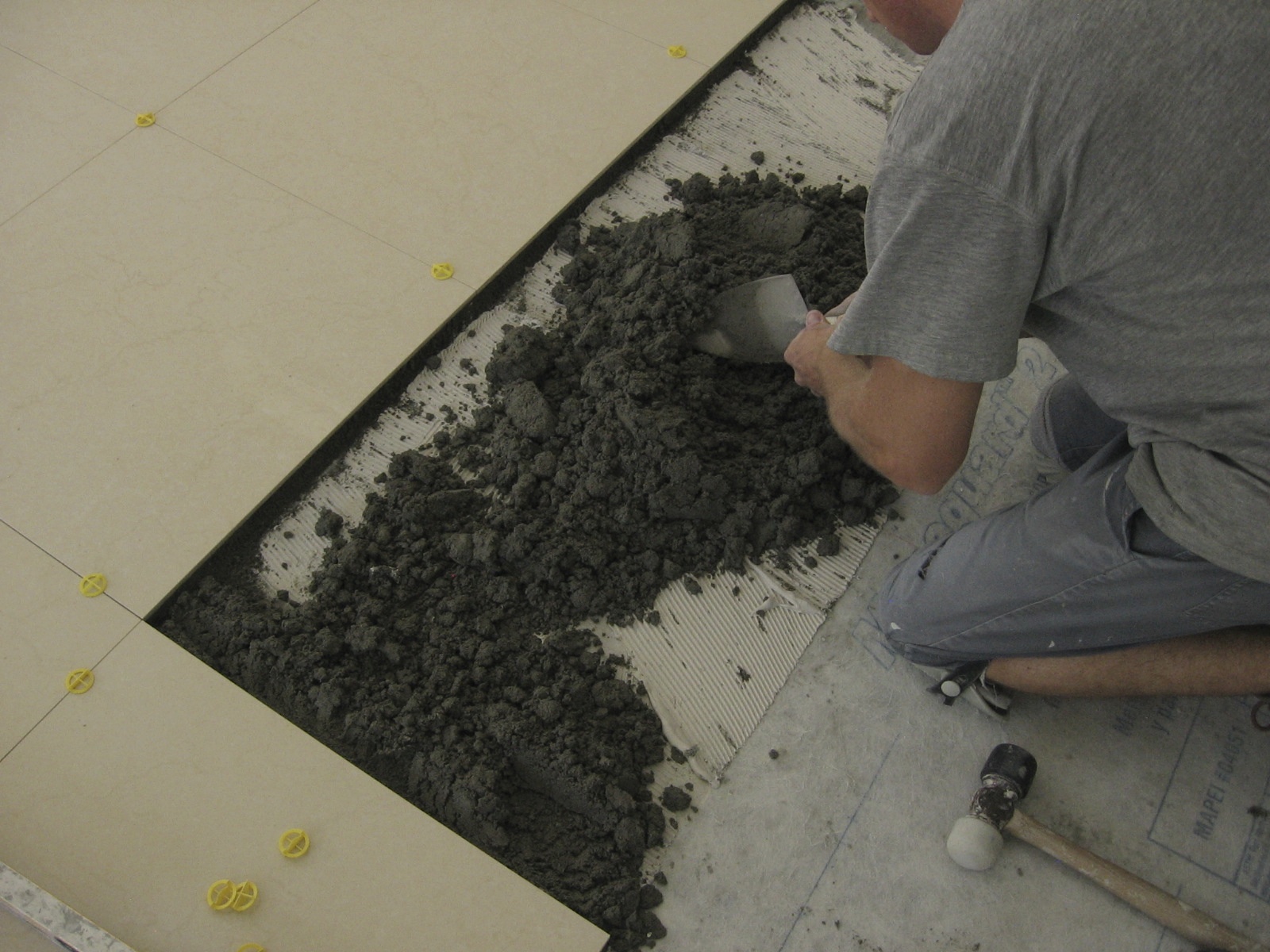 Marble, Travertine or a Rectified Porcelain Mud Set Floor