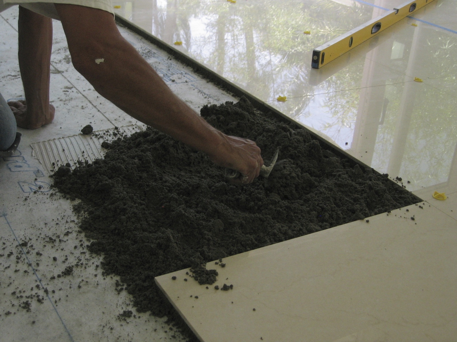 Marble, Travertine or a Rectified Porcelain Mud Set Floor