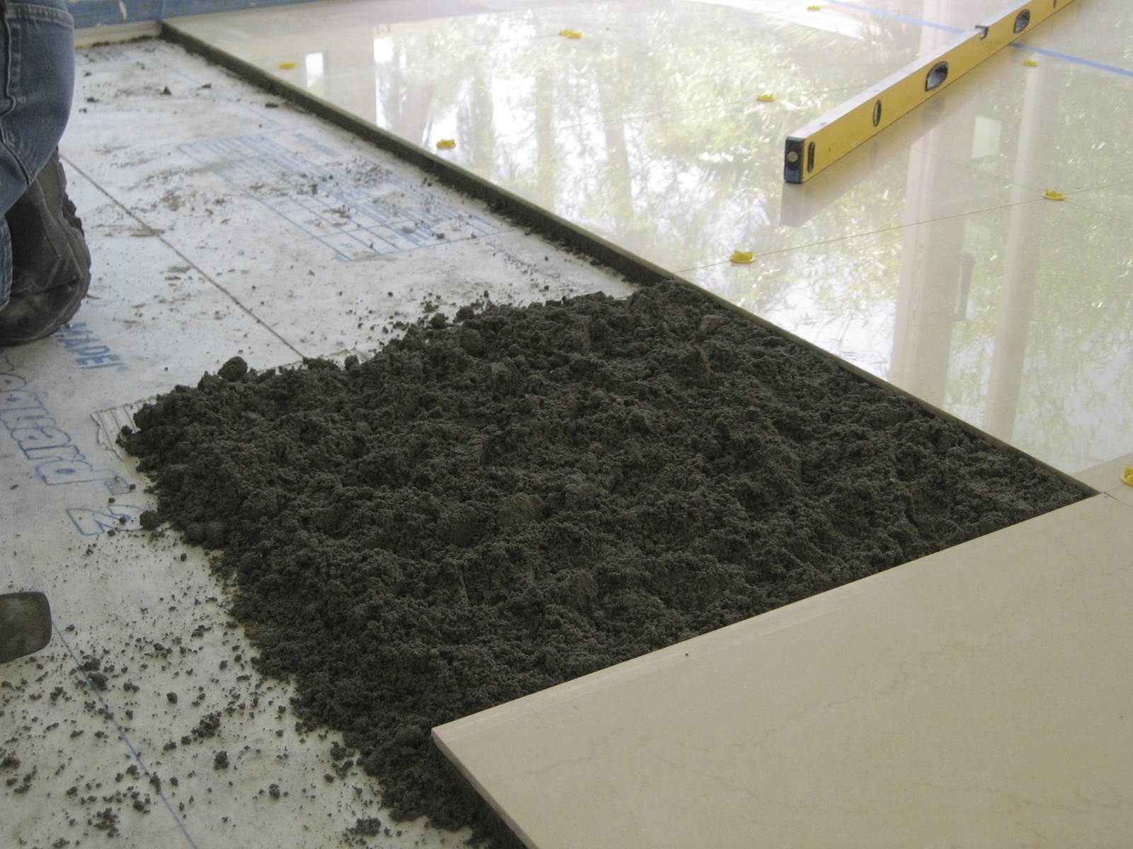 Marble, Travertine or a Rectified Porcelain Mud Set Floor